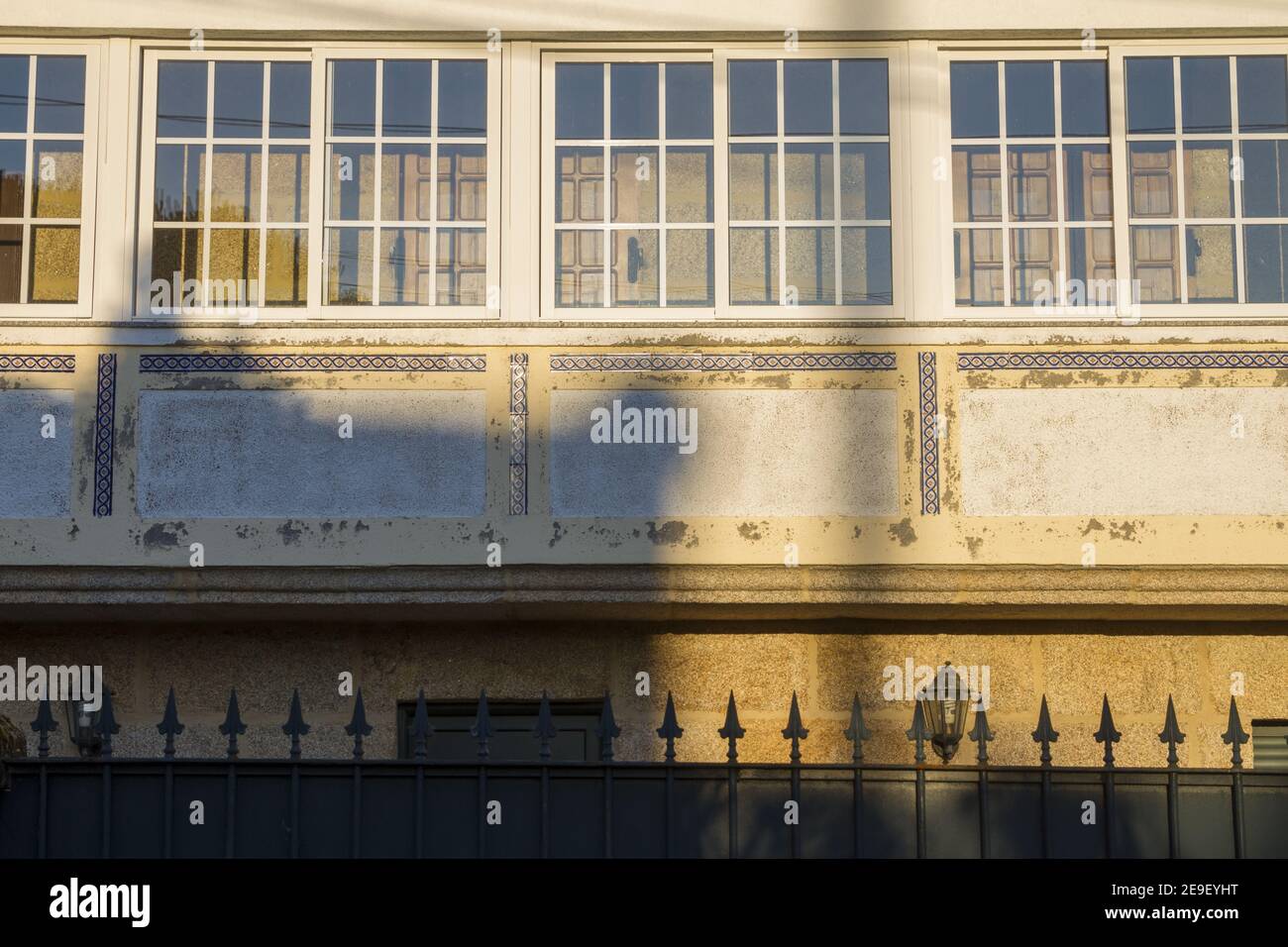 Vintage building's windows at golden hour Stock Photo - Alamy