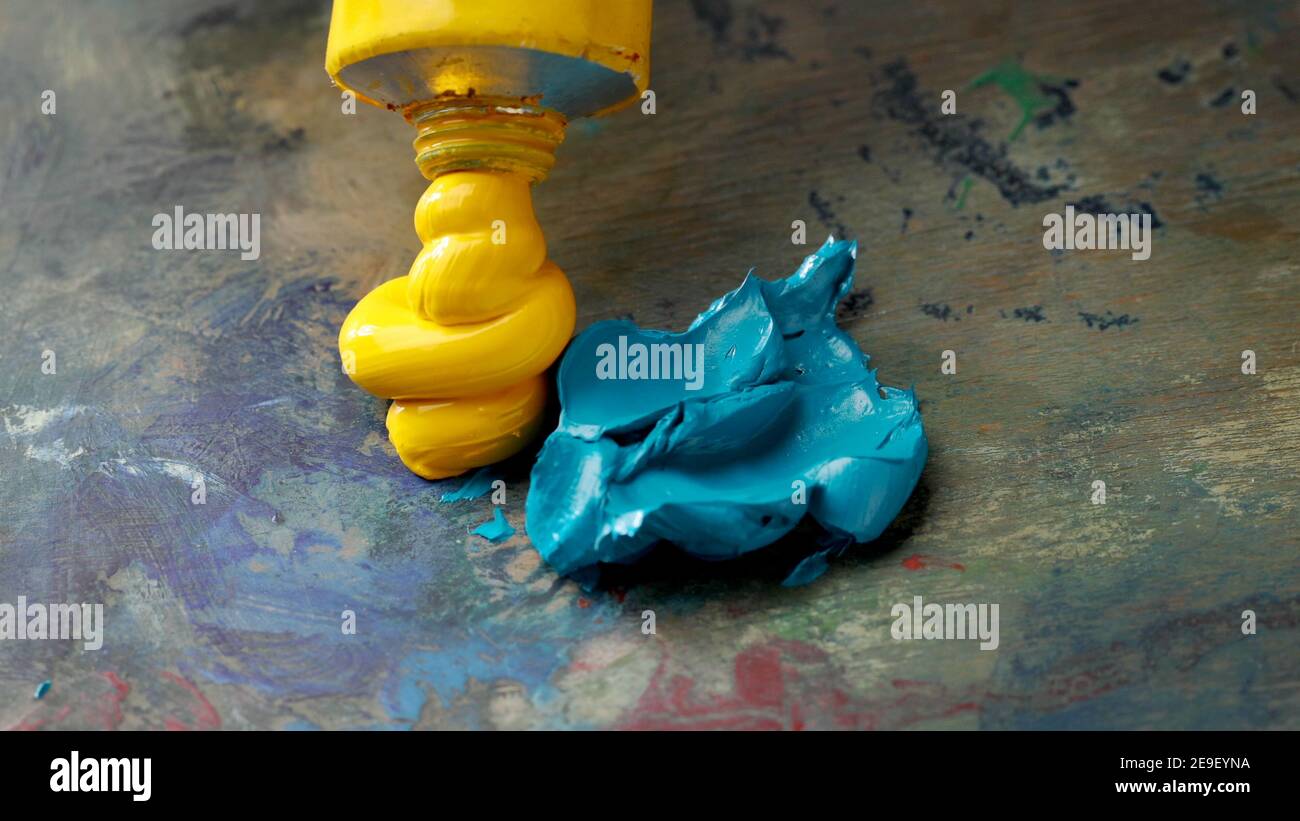 squeezing oil paint on artist palette, selective focus Stock Photo - Alamy