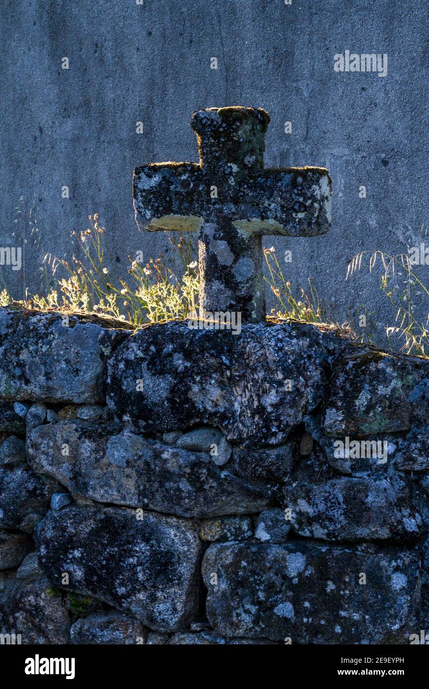 Vertical shot of a weathered tomb cross on a gloomy day Stock Photo - Alamy
