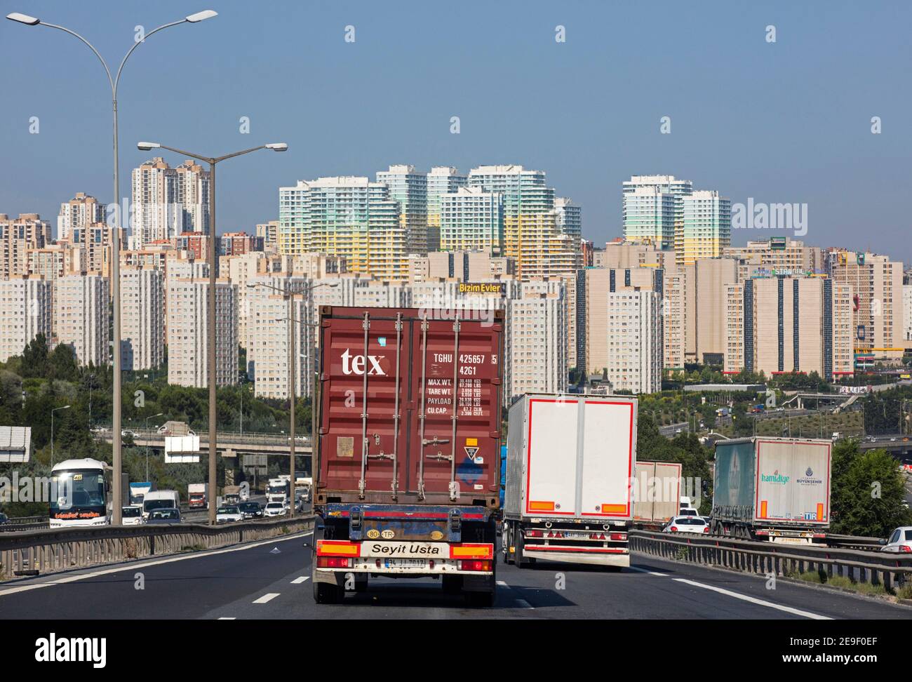 Trucks driving on 10-lane freeway / motorway to the city Istanbul ...