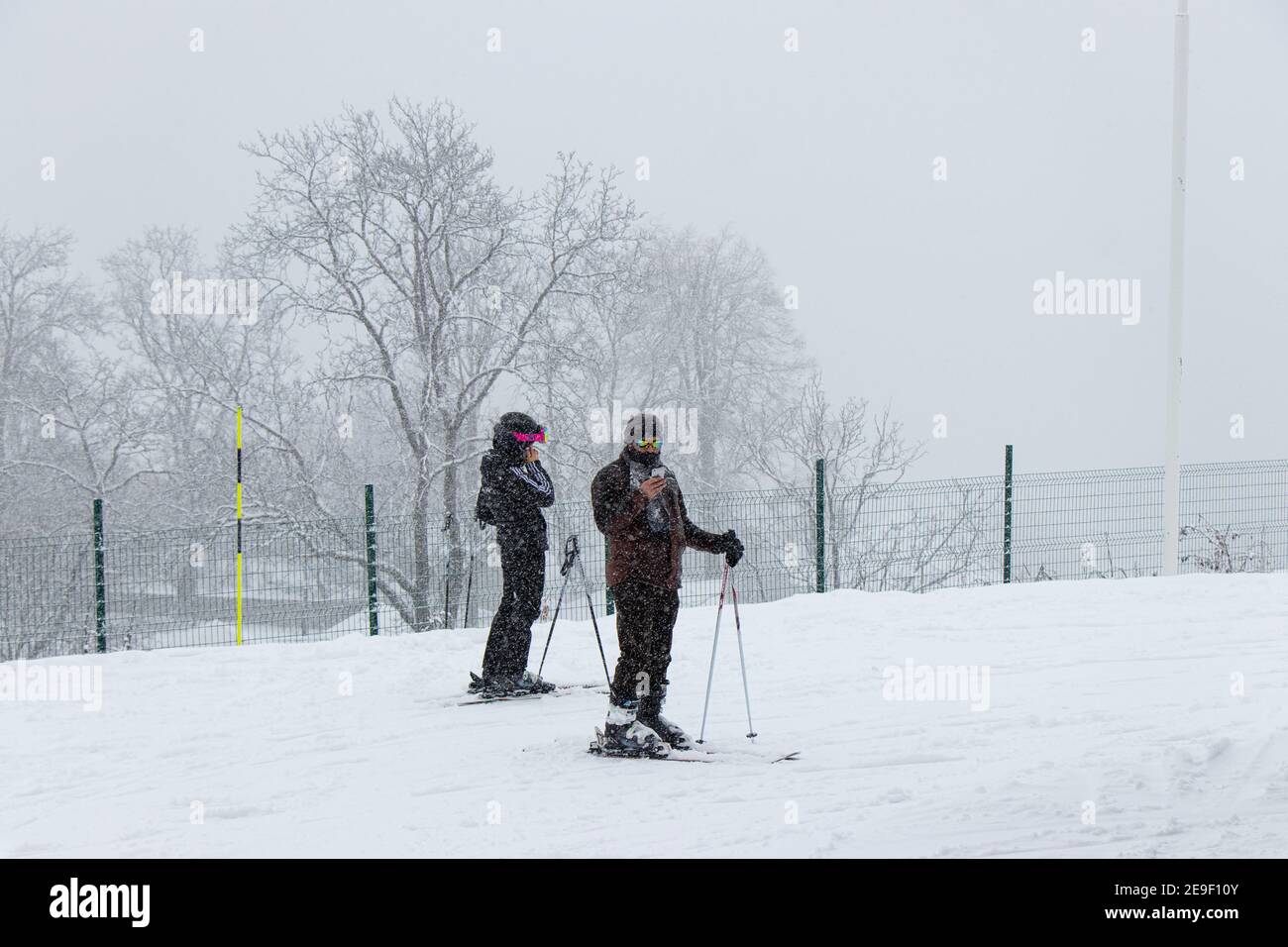 Skiers under heavy snow. Winter holiday. Snowy day. Tufandag, Gabala ...