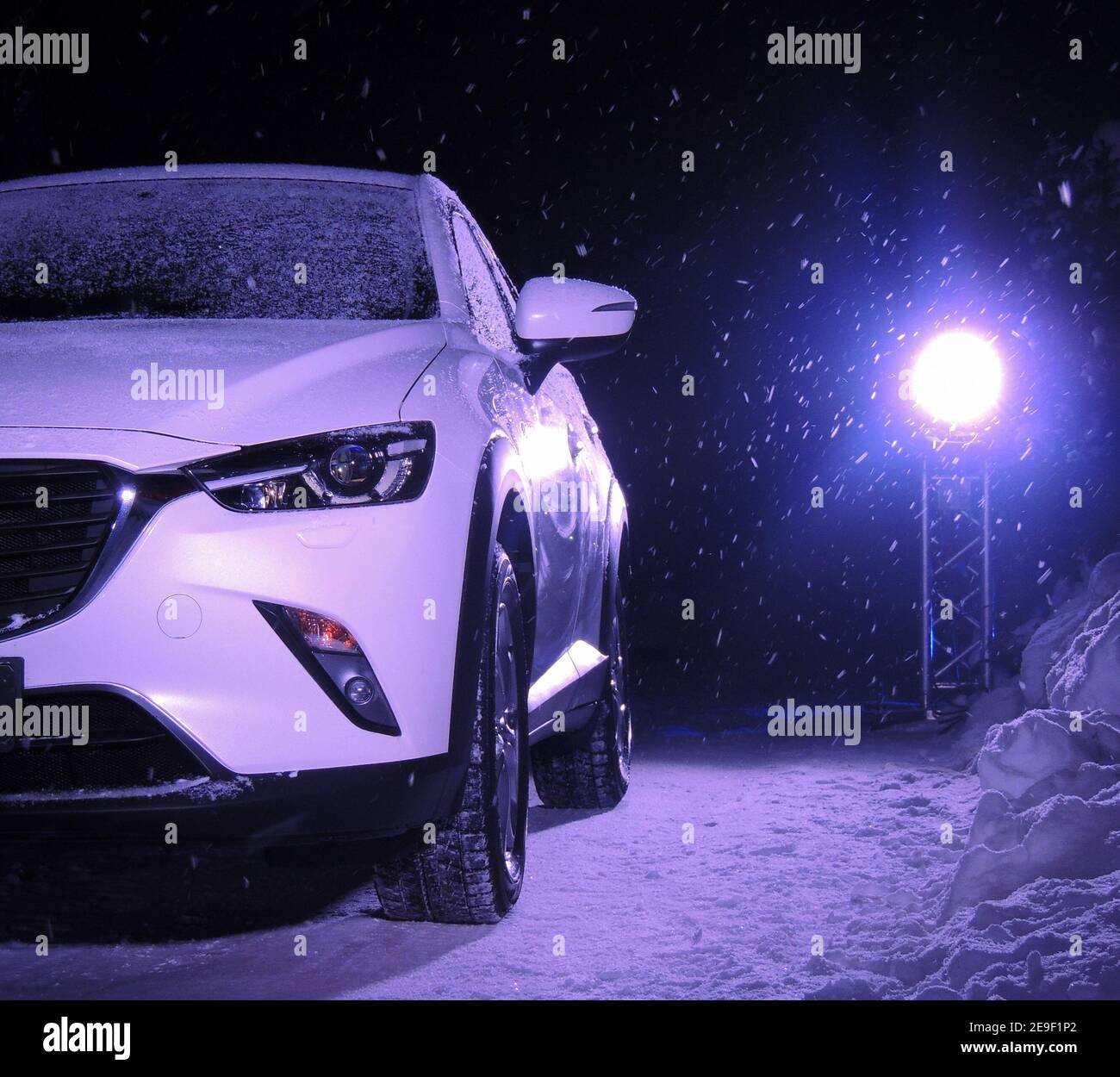Car Turn Out Headlight In Front Of Spotlight At Night Snowfall Stock ...