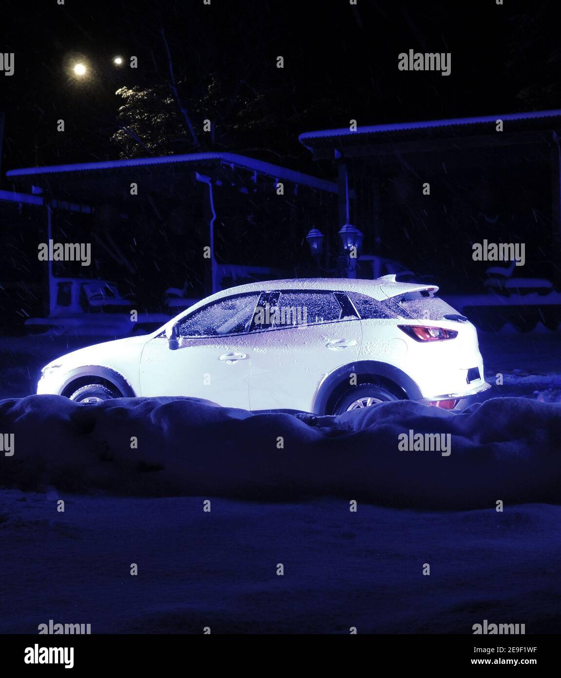 SUV Car On A Snowy Roadside At Night Time Stock Photo - Alamy