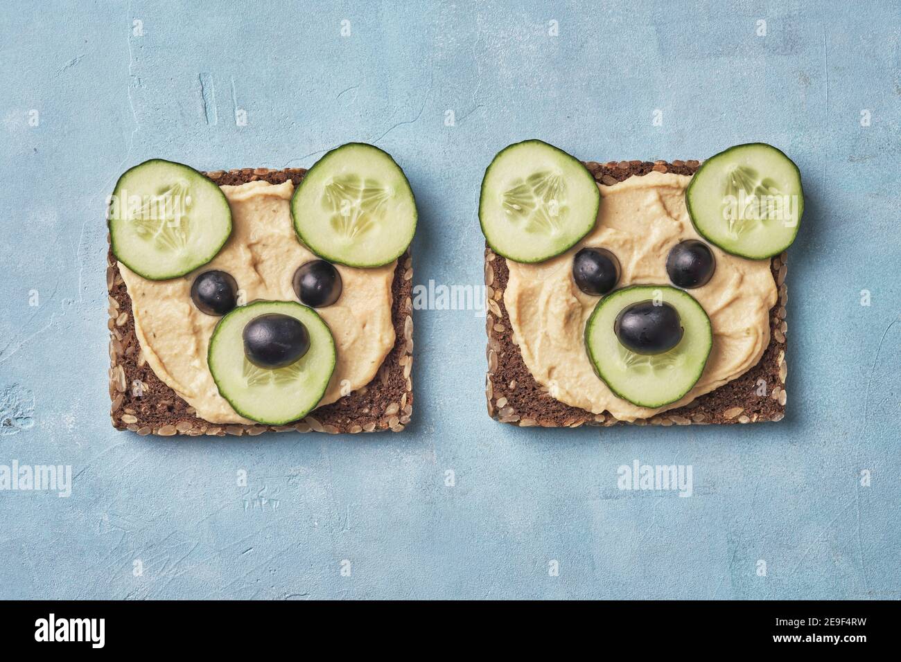 Funny bear toast with cucumber and hummus toasts Stock Photo - Alamy