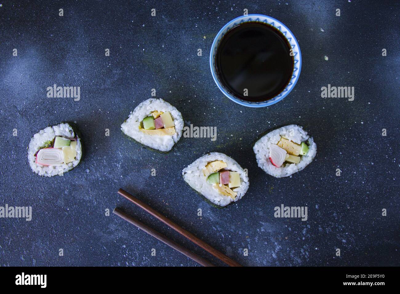 Top view of kimbap with soy souse on a blue surface Stock Photo - Alamy