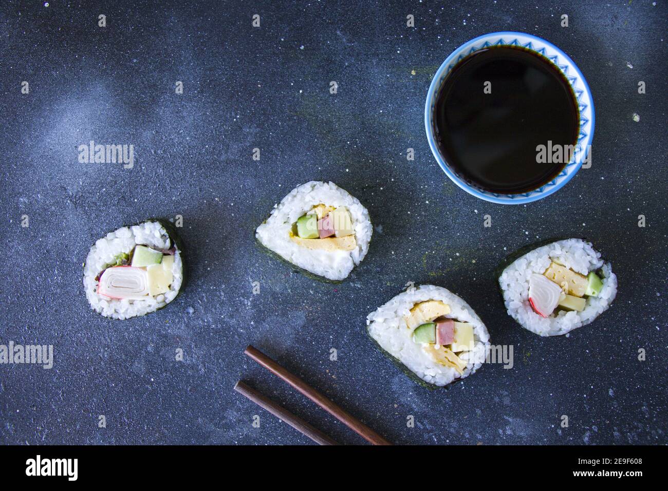 Top view of kimbap with soy souse on a blue surface Stock Photo - Alamy