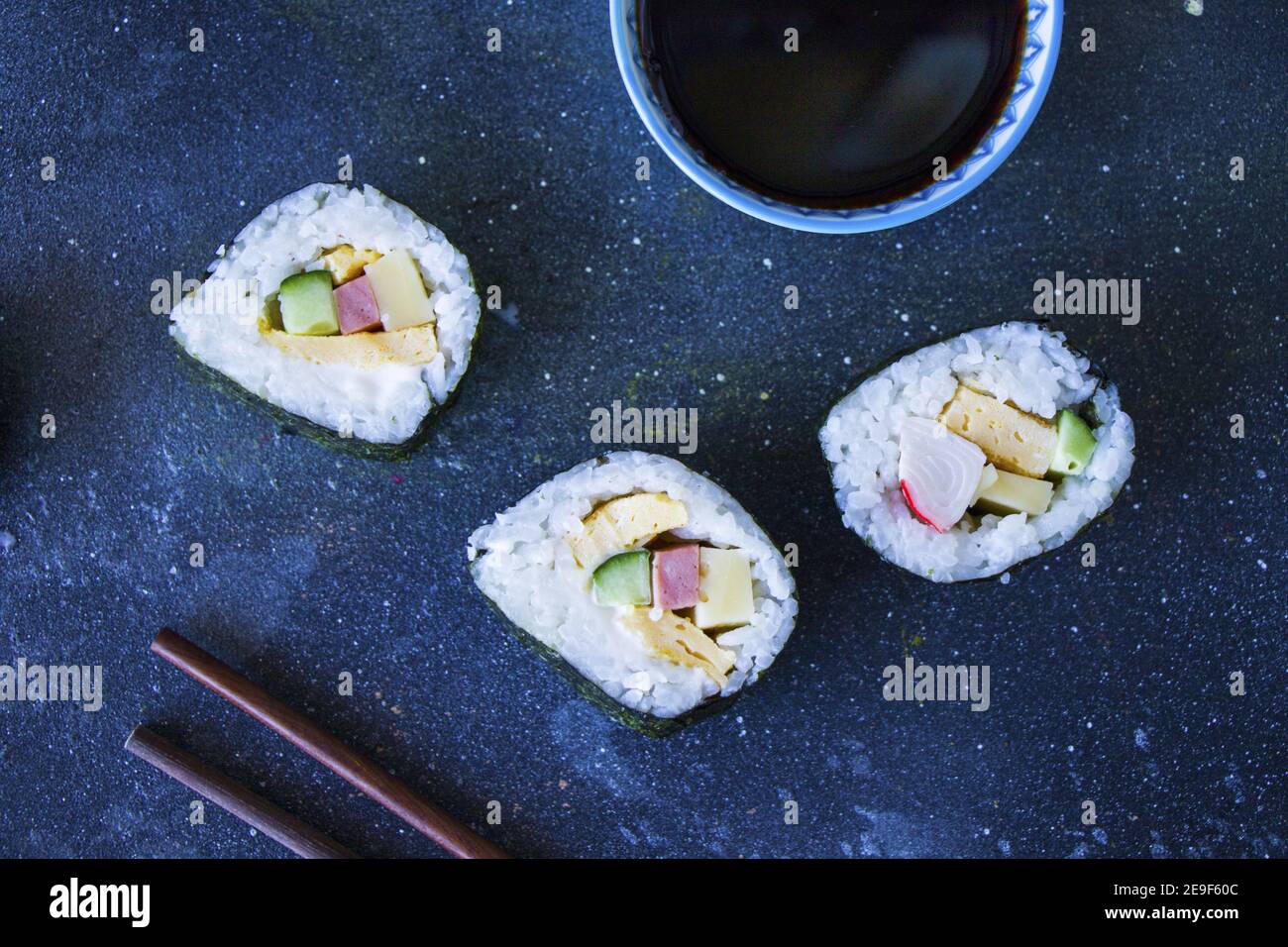 Top view of kimbap with soy souse on a blue surface Stock Photo - Alamy