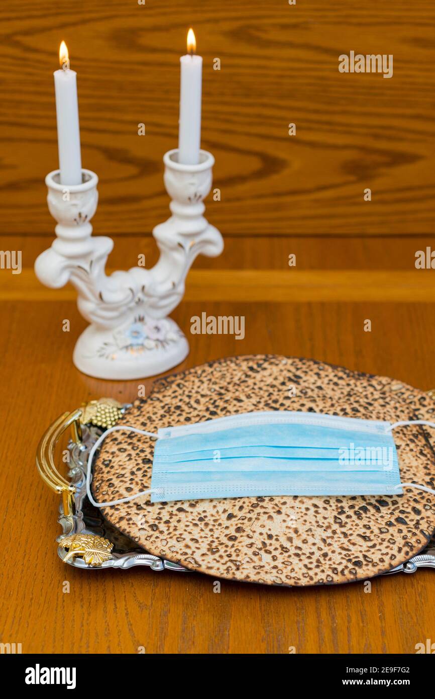 Corona Passover. Dust mask, bottle of wine and matzah - a traditional ...
