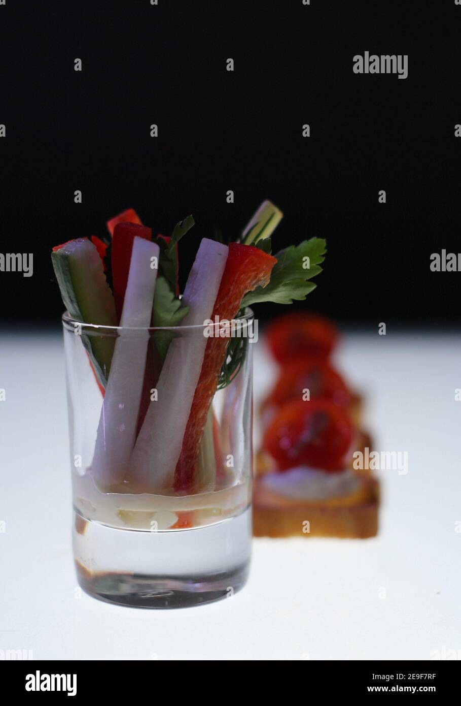 Delicious salad mix in verrines on black backgrounds isolated Stock ...