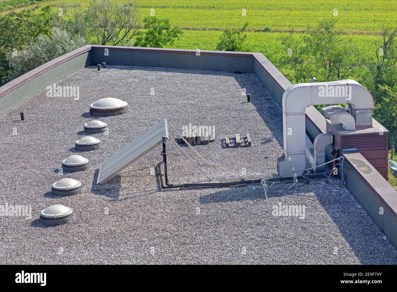 Ventilation Air Duct Solar Panel Skylight Windows at Gravel Flat Roof ...