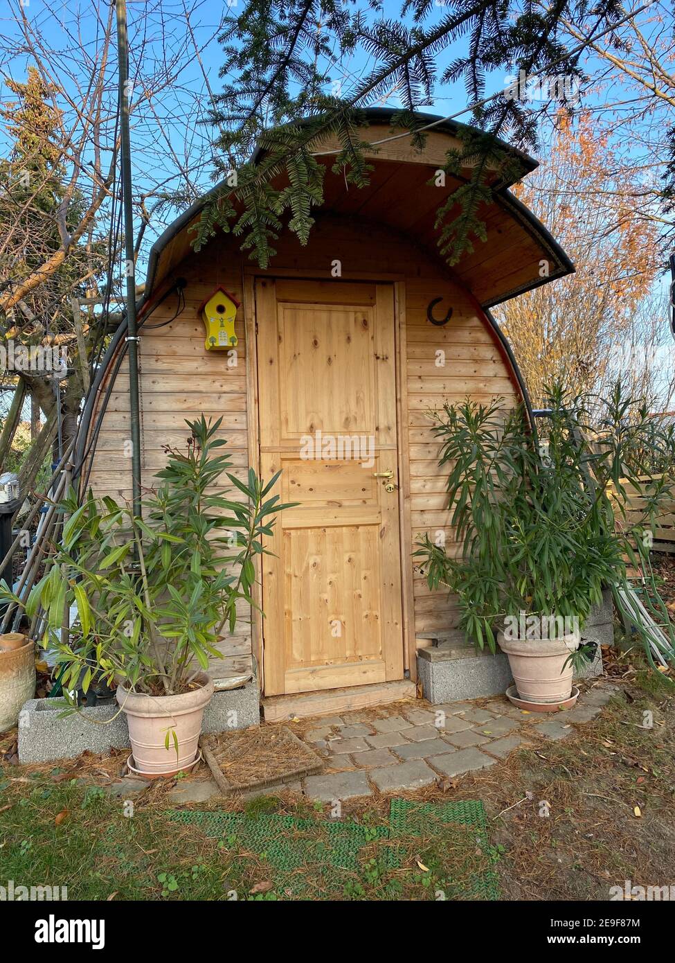 Barrel In Garden, Garden Hut Stock Photo - Alamy