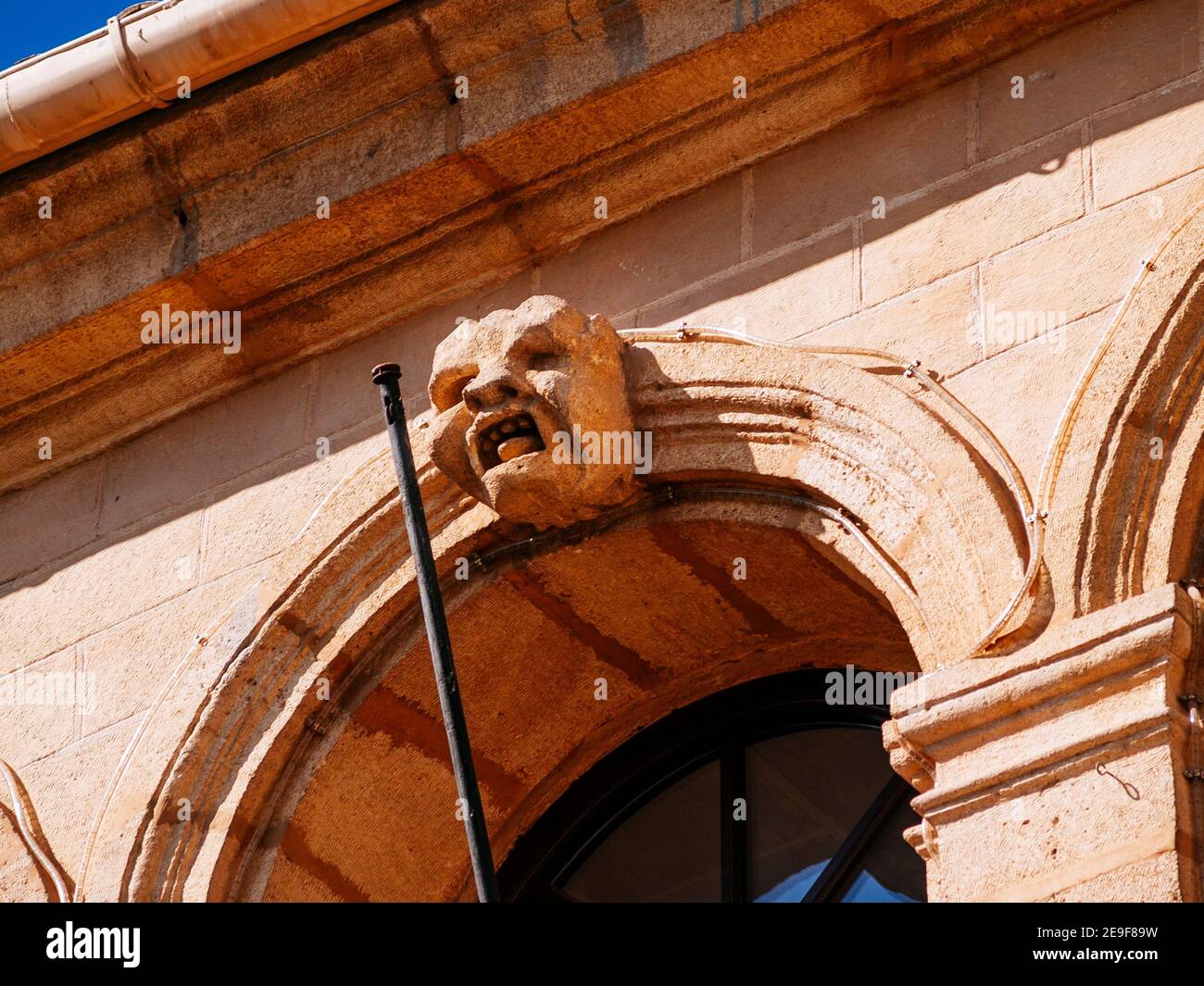 Detail of the masks in the arches of the upper gallery, representing ...