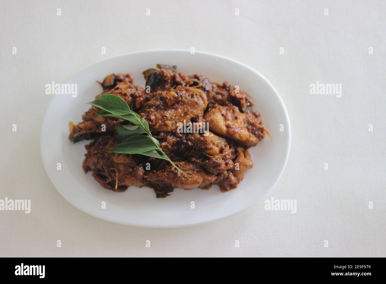 Dry gravy chicken roast prepared in Kerala style with cocunut oil and ...
