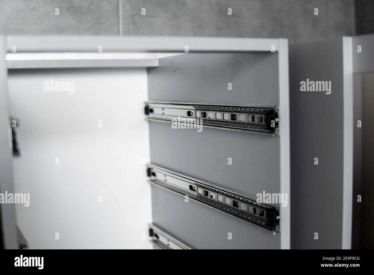 Stainless telescopic bayonet drawer slide guides, installed on a ...