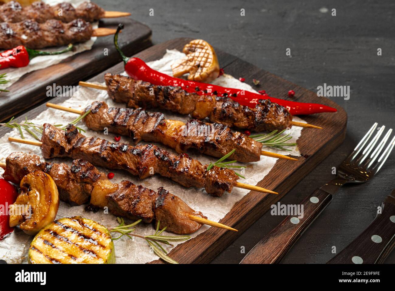Grilled meat skewers barbecue served on board Stock Photo - Alamy