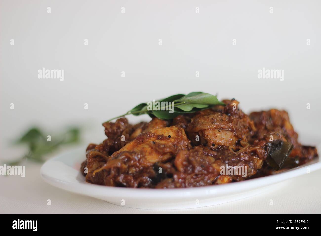 Kerala style spicy chicken roast hi-res stock photography and images ...