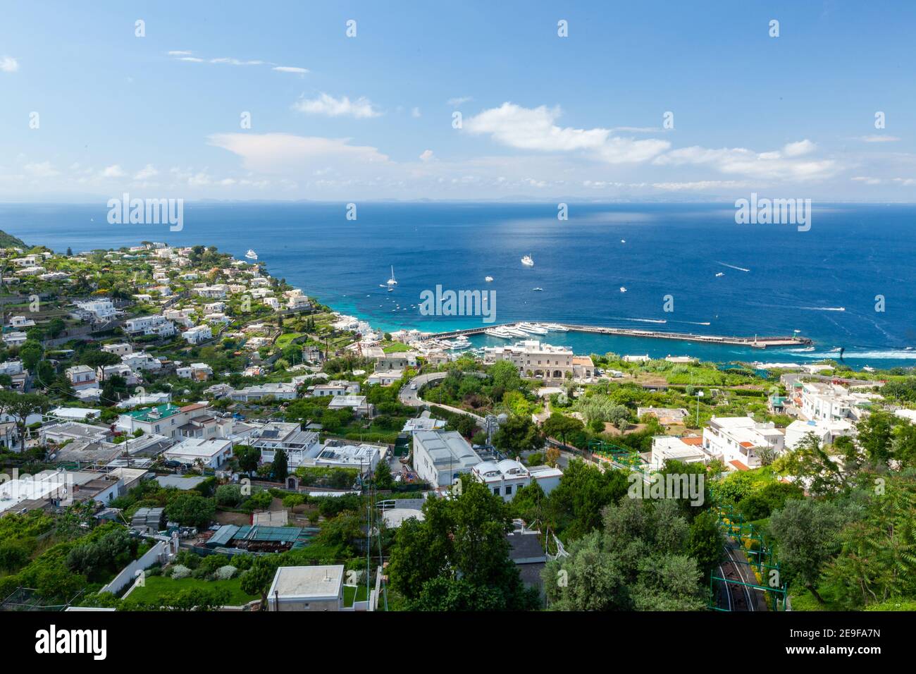 Bird's eye view of Capri island with sea and green mountain landscape ...