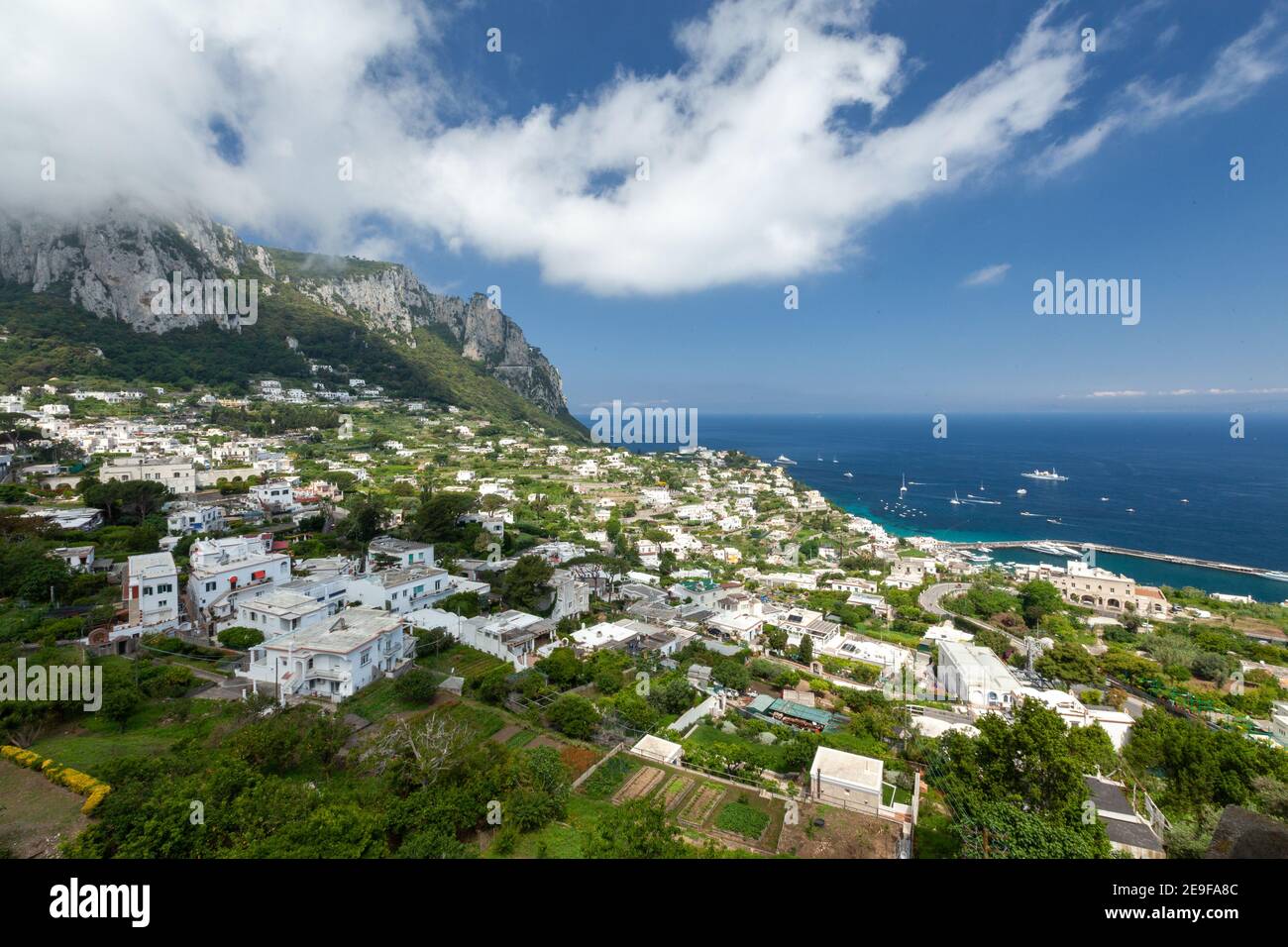 Bird's eye view of Capri island with sea and green mountain landscape ...