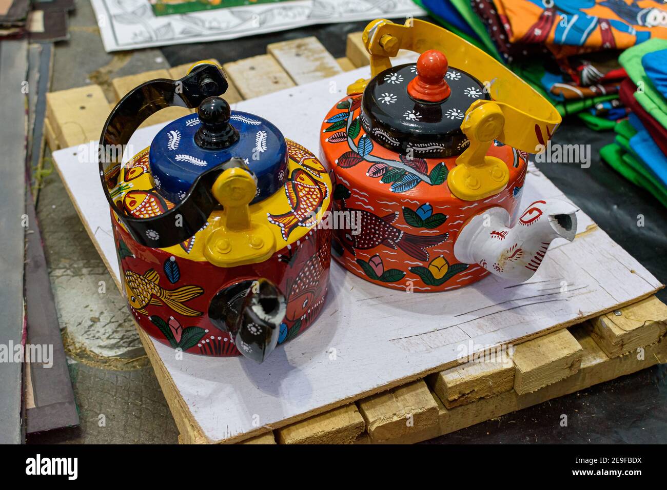 Beautiful handmade decorative traditional Indian kettles are displayed ...