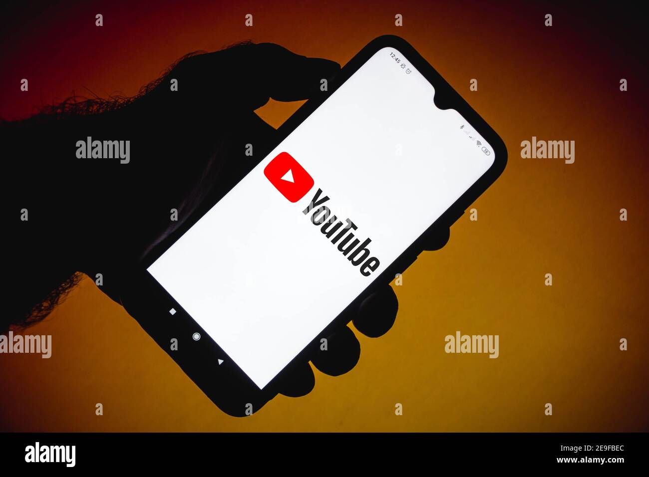 In this photo illustration the YouTube logo seen displayed on a ...