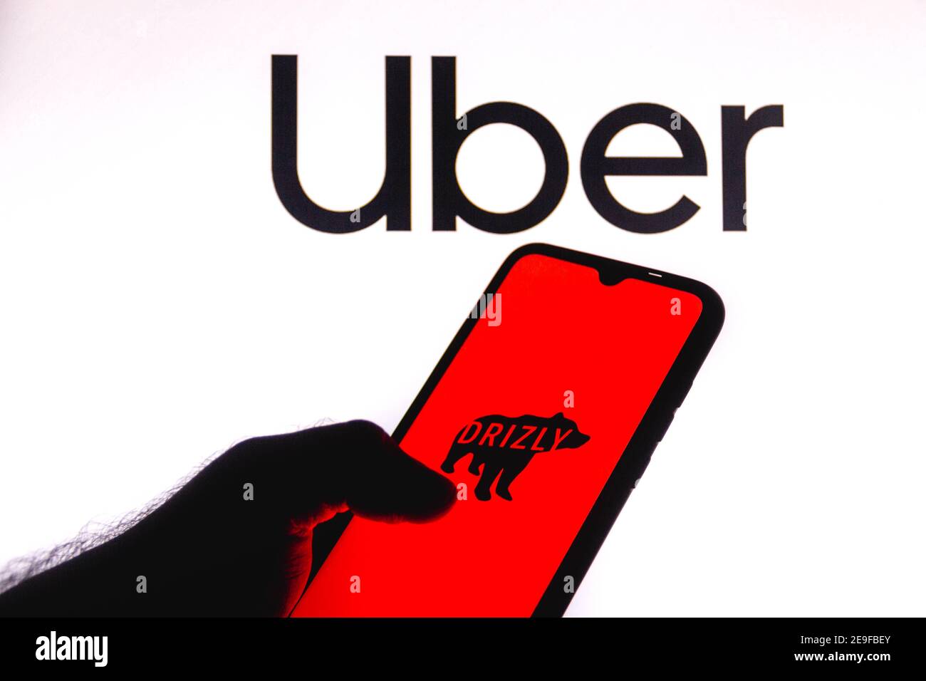 In this photo illustration a Drizly logo seen displayed on a smartphone ...