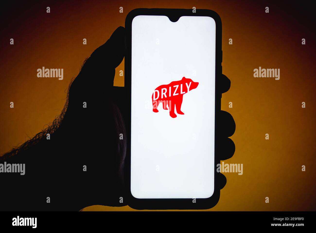 In this photo illustration the Drizly logo seen displayed on a ...