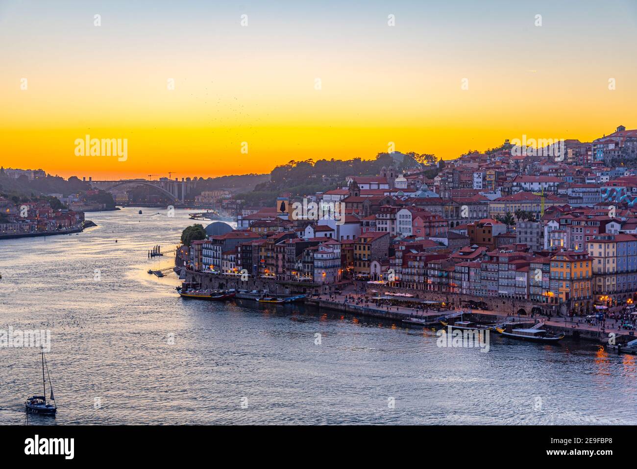Sunset view of Douro riverside at Ribeira quay at Porto, Portugal Stock ...