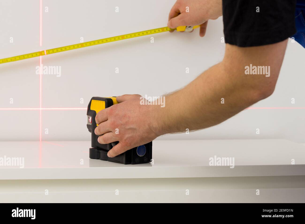 a specialist makes measurements using an electronic laser measuring the ...