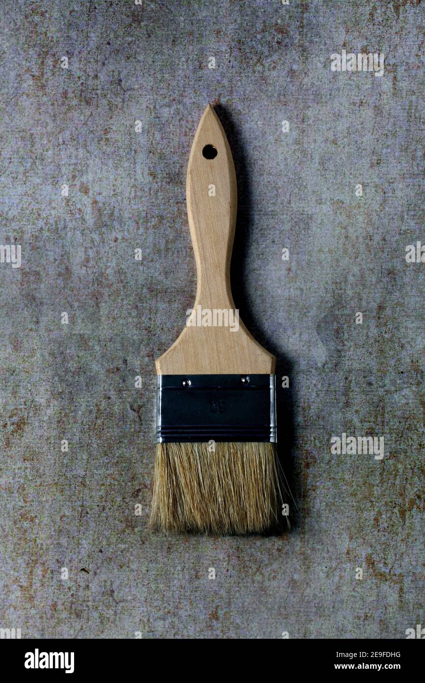 Vertical top view of a wall painting brush Stock Photo - Alamy