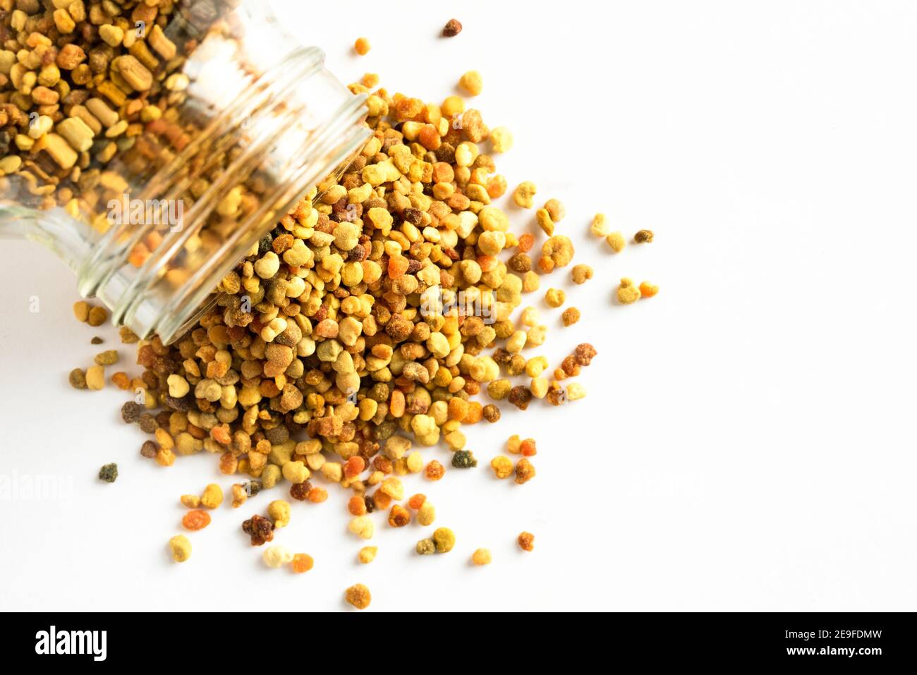 Bee Pollen Spilled from a Jar Stock Photo - Alamy