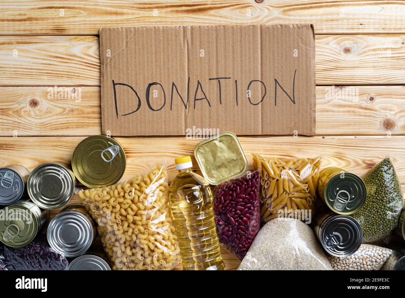 Food donations on the table. Text Donation Stock Photo - Alamy