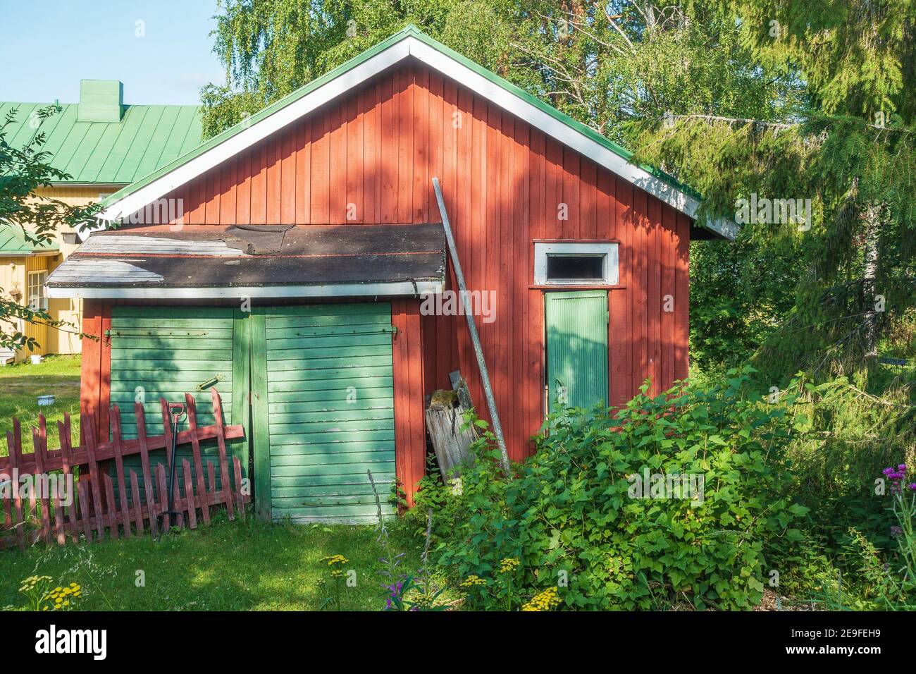 Nordic red outhouse with green doors in Ylitornio Finland Stock Photo ...