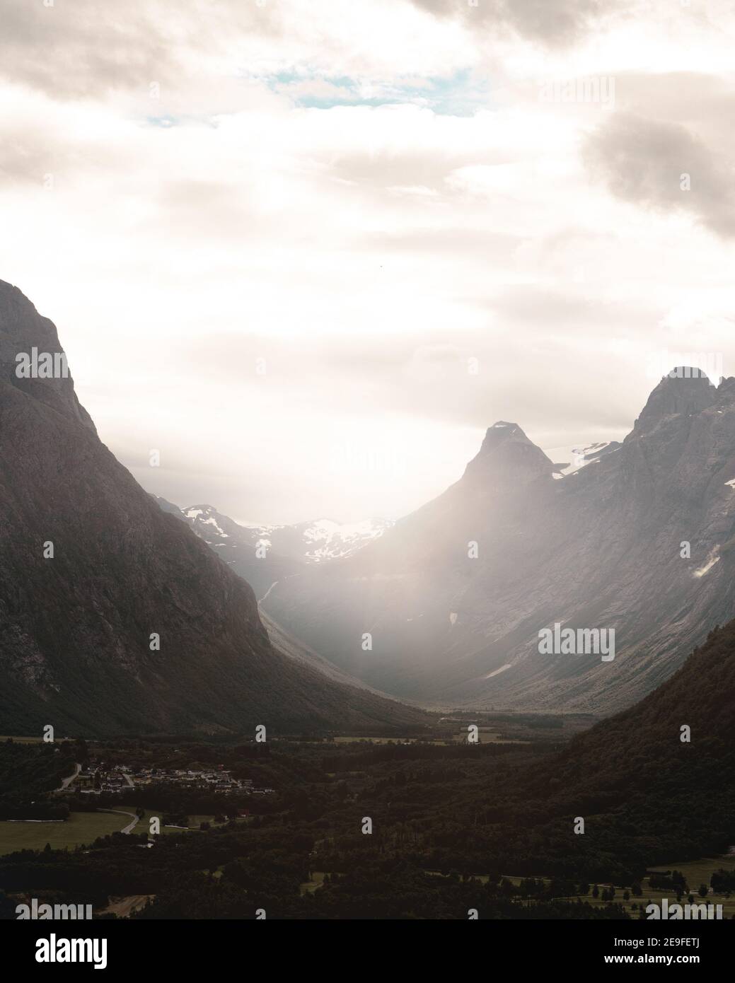 Vertical shot of forested rocky mountains under the sunlight Stock ...