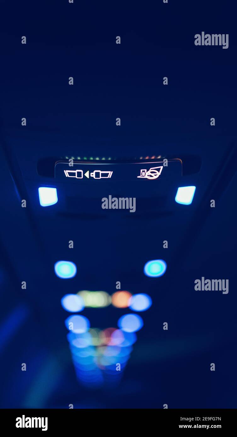 Vertical shot of airplane signs and symbols lit in the darkness Stock ...