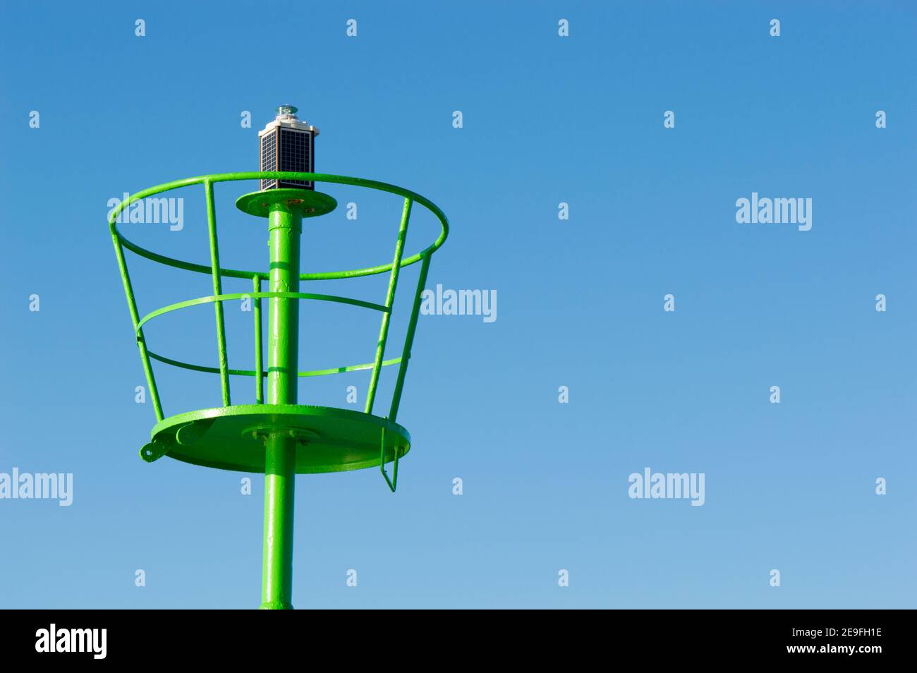 Detail of green beacon, navigation light signal for the entrance in a ...