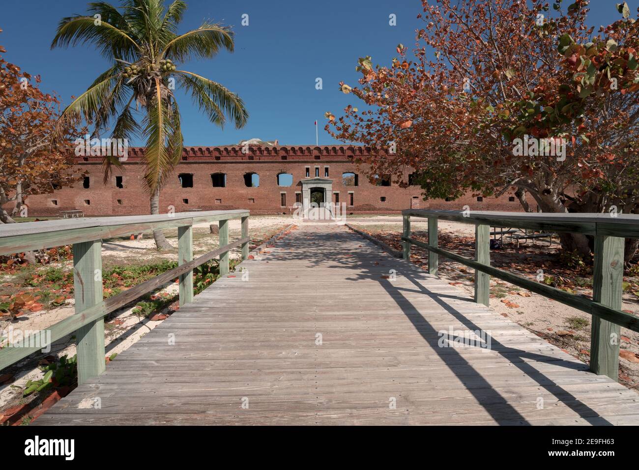 Gate of an old military fort with a wooden walk in the foreground. Big ...