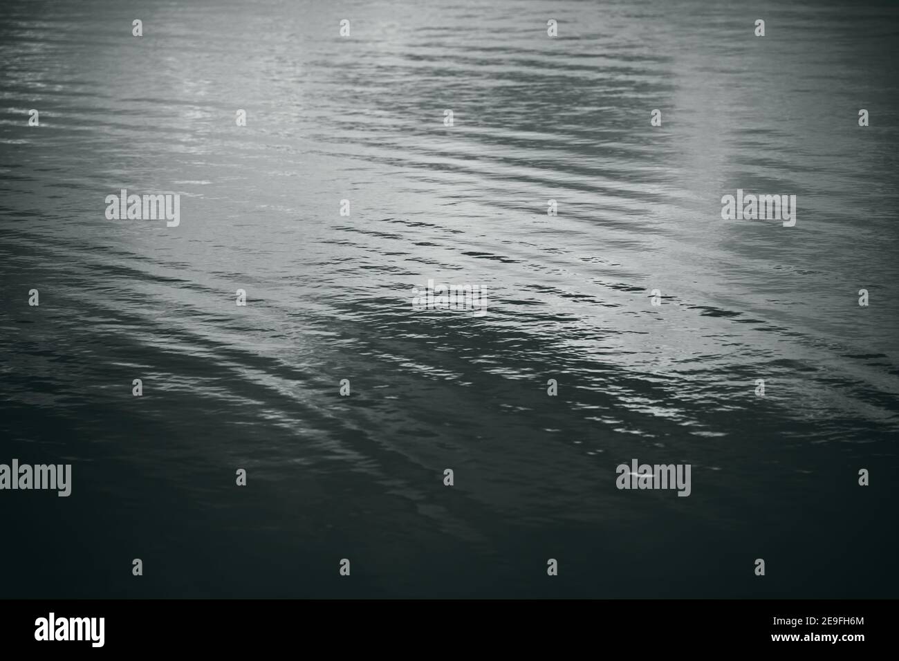 Grayscale shot of a calm water of the sea without wave Stock Photo - Alamy