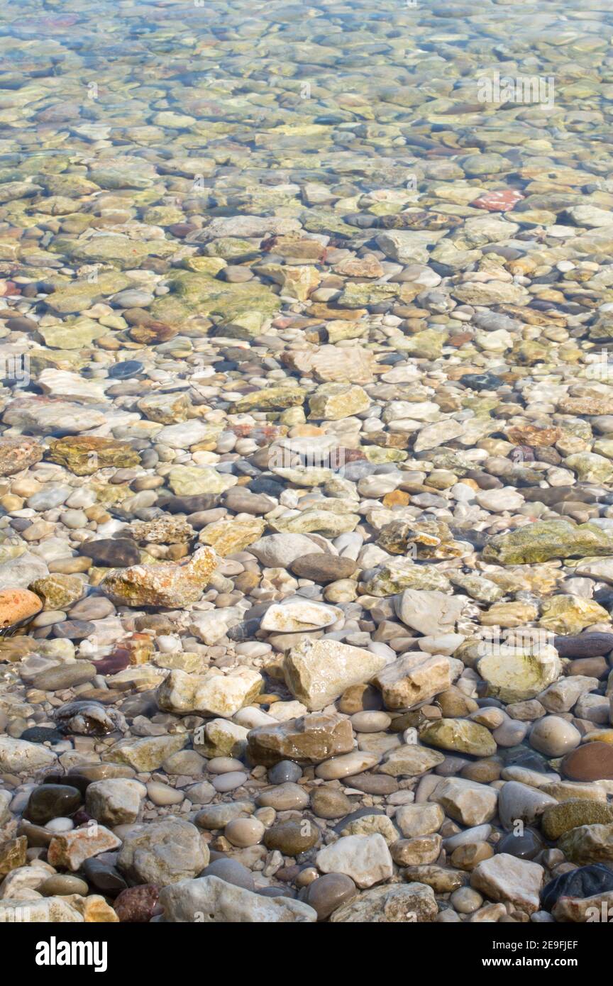 Colorful sea stones under water, sea pebbles, transparent clear water ...