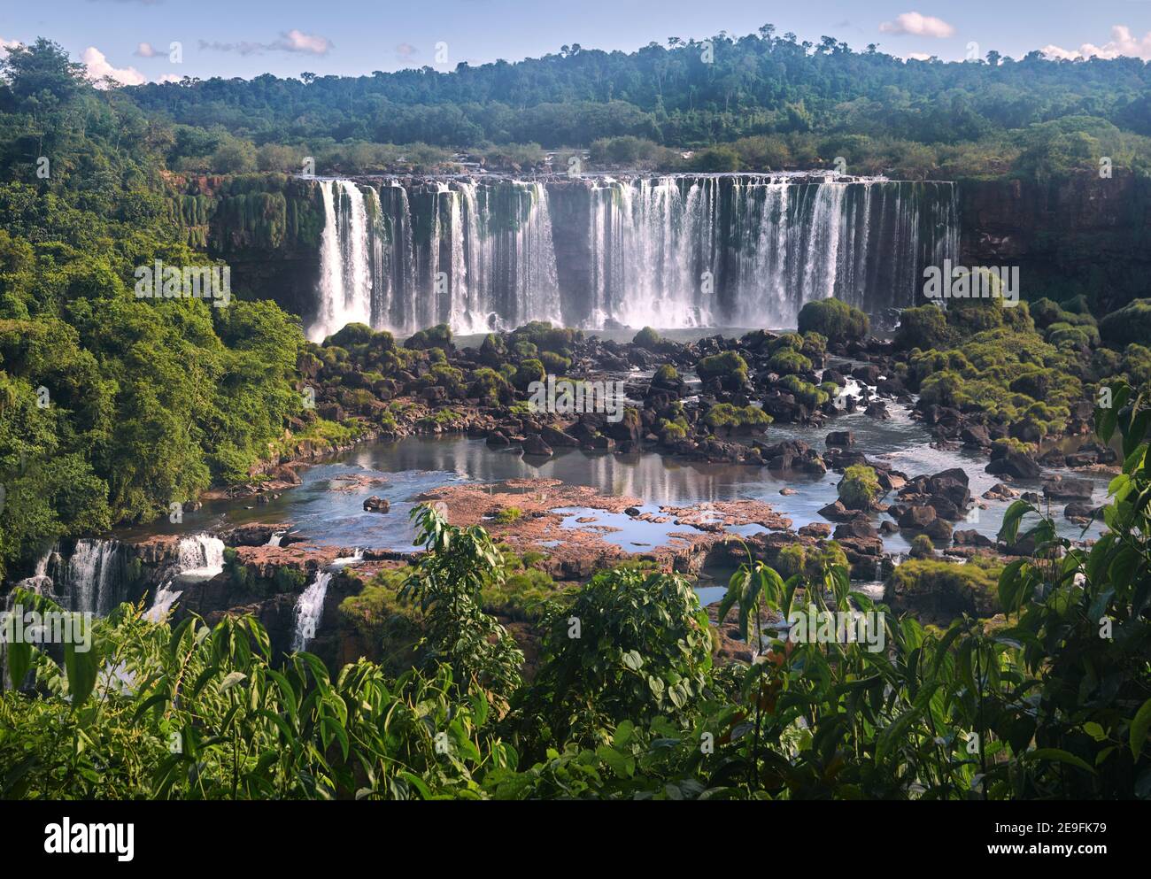 Mesmerizing view of the beautiful Iguazu Falls surrounded by greens in ...