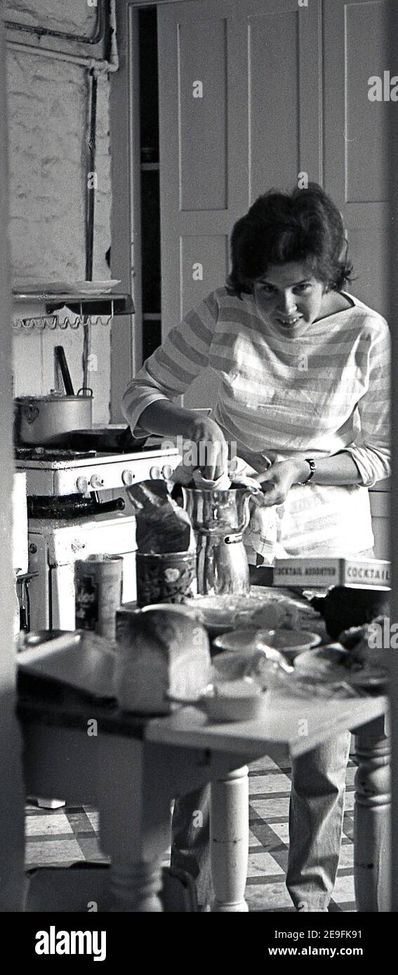 1960s, historical, lad in a small kitchen preparing breakfast Stock ...