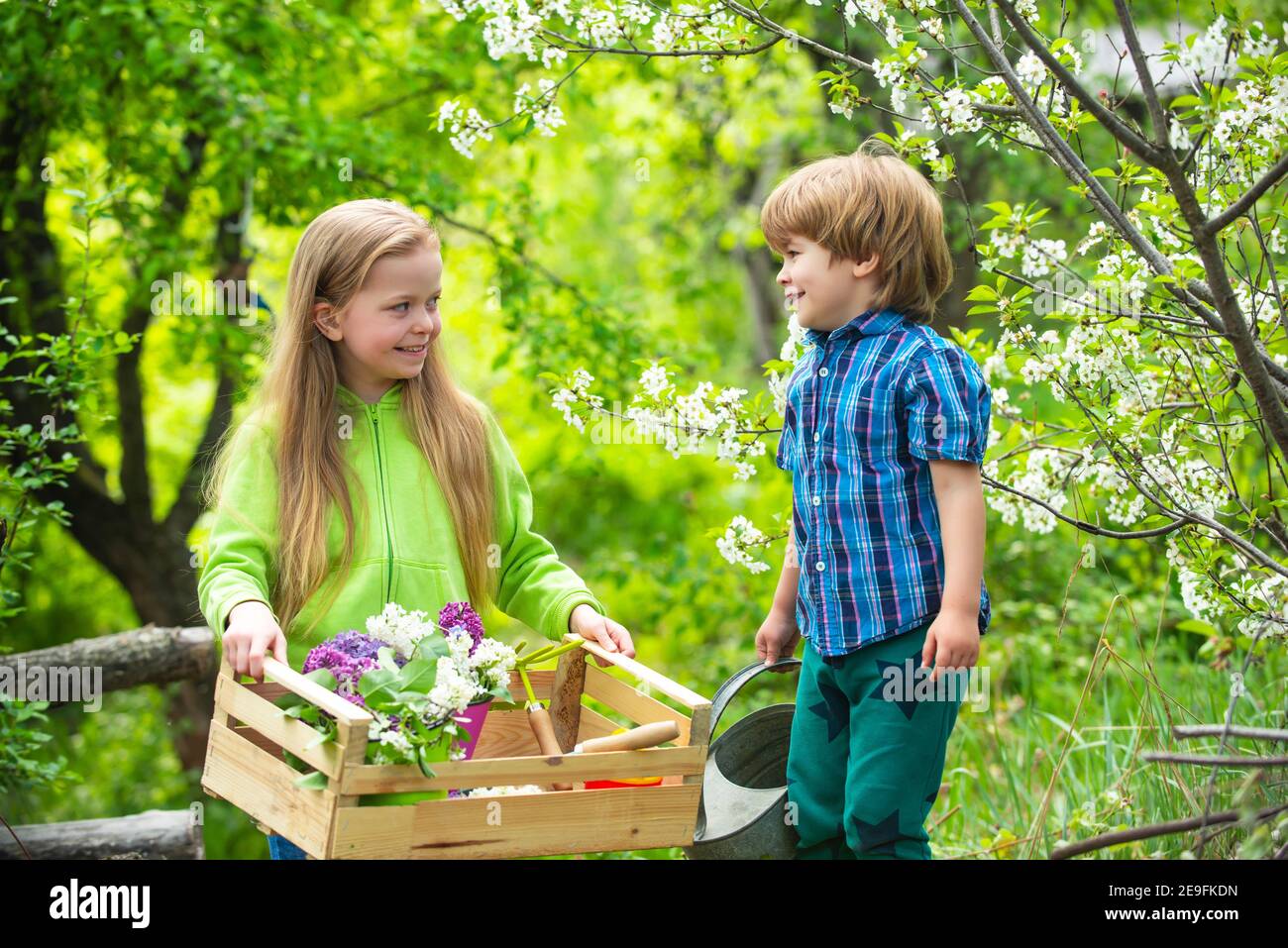 Two little children on countryside farm. Cute toddler girl and boy ...