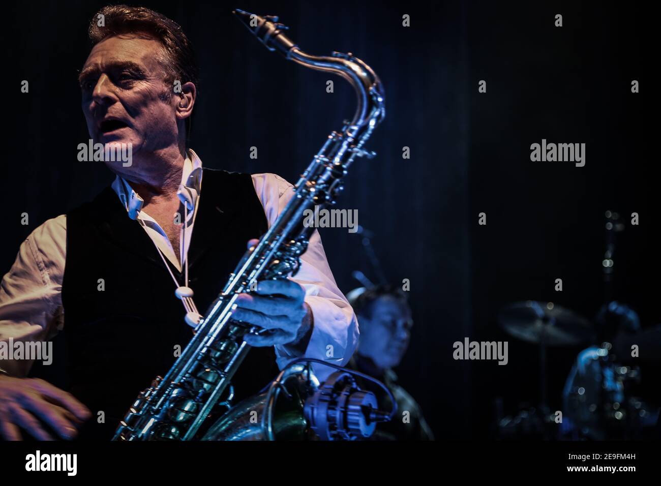 Brian Travers on saxophone with UB40 performing live on stage at the O2 ...