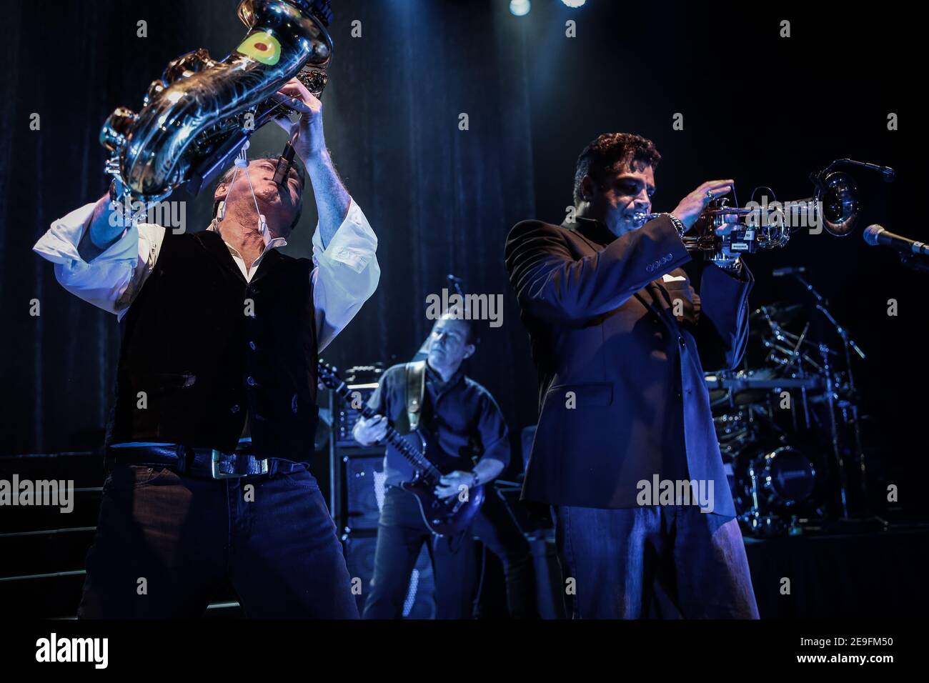 Brian Travers on saxophone with UB40 performing live on stage at the O2 ...