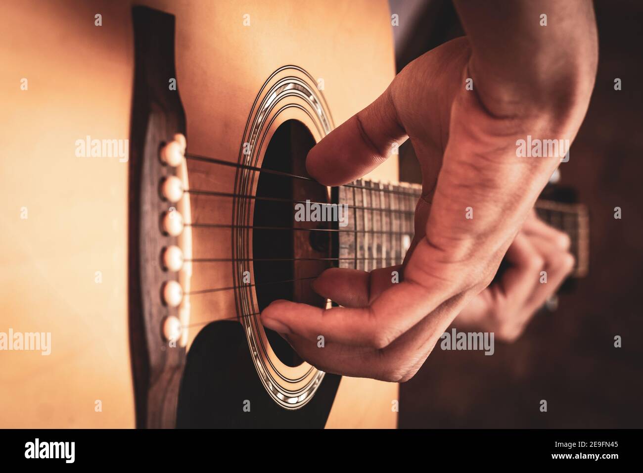 Close up a man's hands playing acoustic guitar. Playing acoustic guitar ...