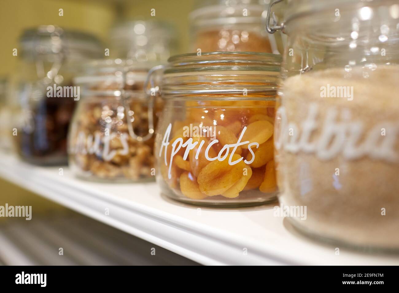 Photograph of dried fruit, nuts and seeds in glass jars Stock Photo - Alamy