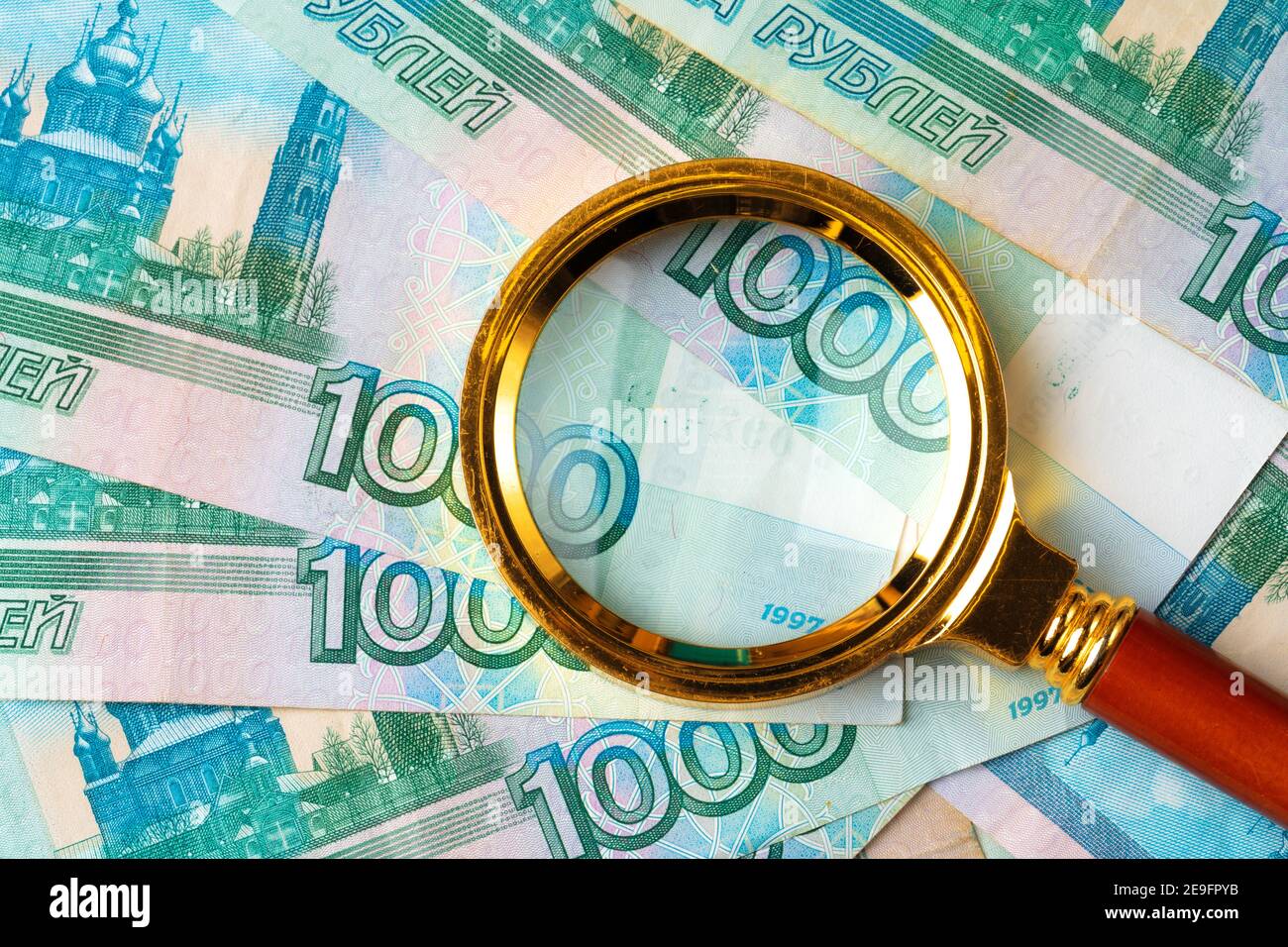 Magnifying Glass on the Russian Currency Rubles Stock Photo - Alamy