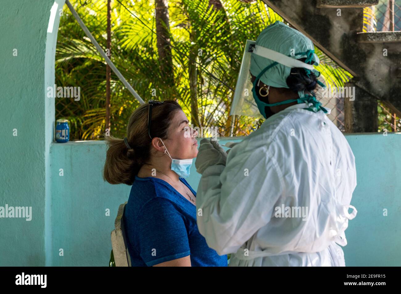 Cuban healthcare worker is testing foreign visitors at their home after ...