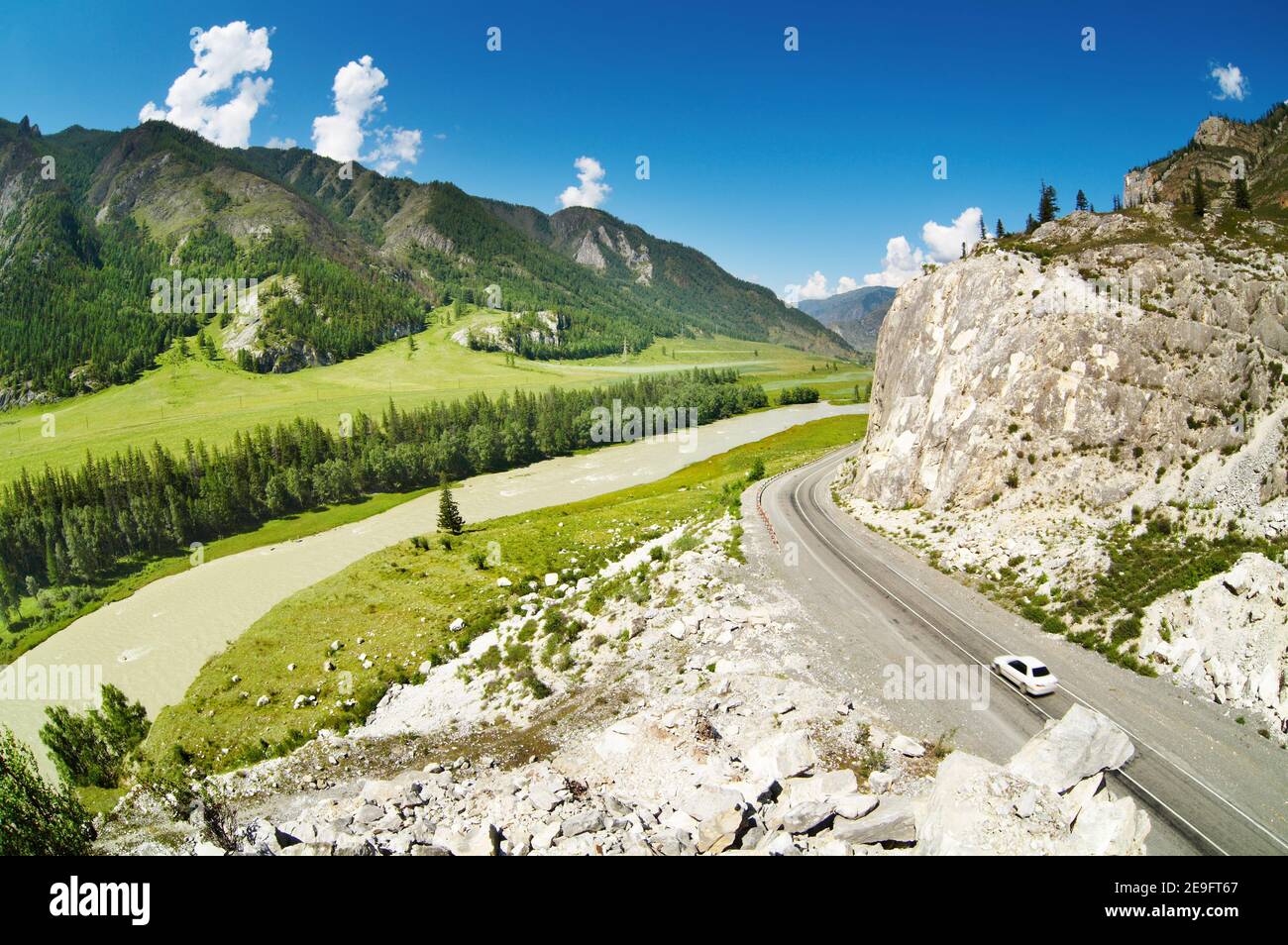 Mountain landscape with road and river Stock Photo - Alamy