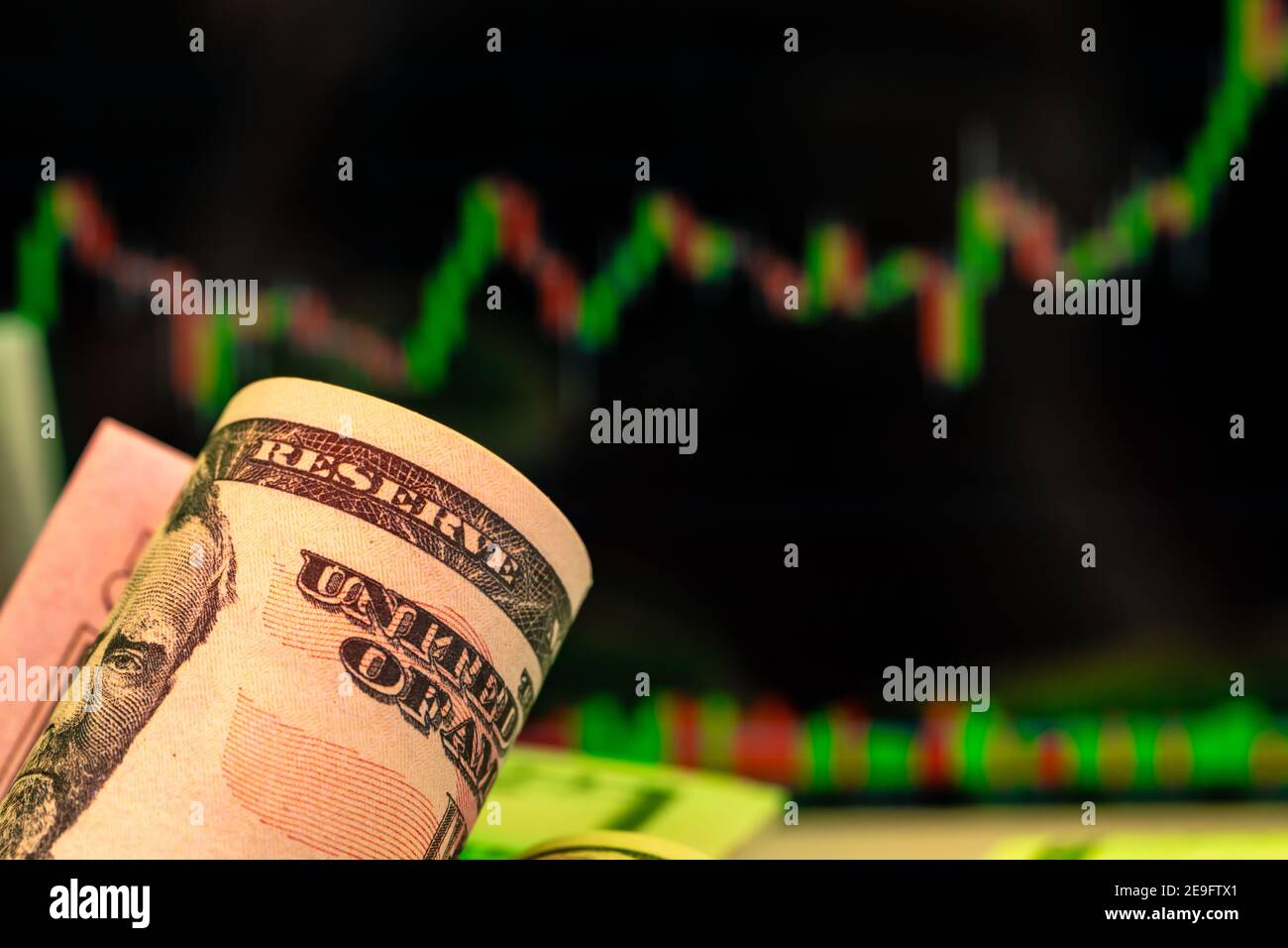 American dollar banknotes and graph on black background Stock Photo - Alamy
