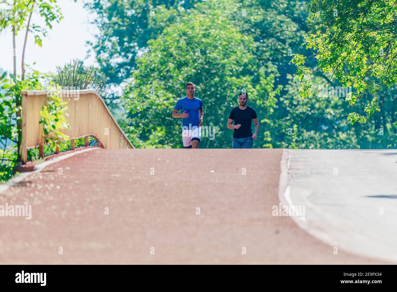 Boys running through forest hi-res stock photography and images - Alamy